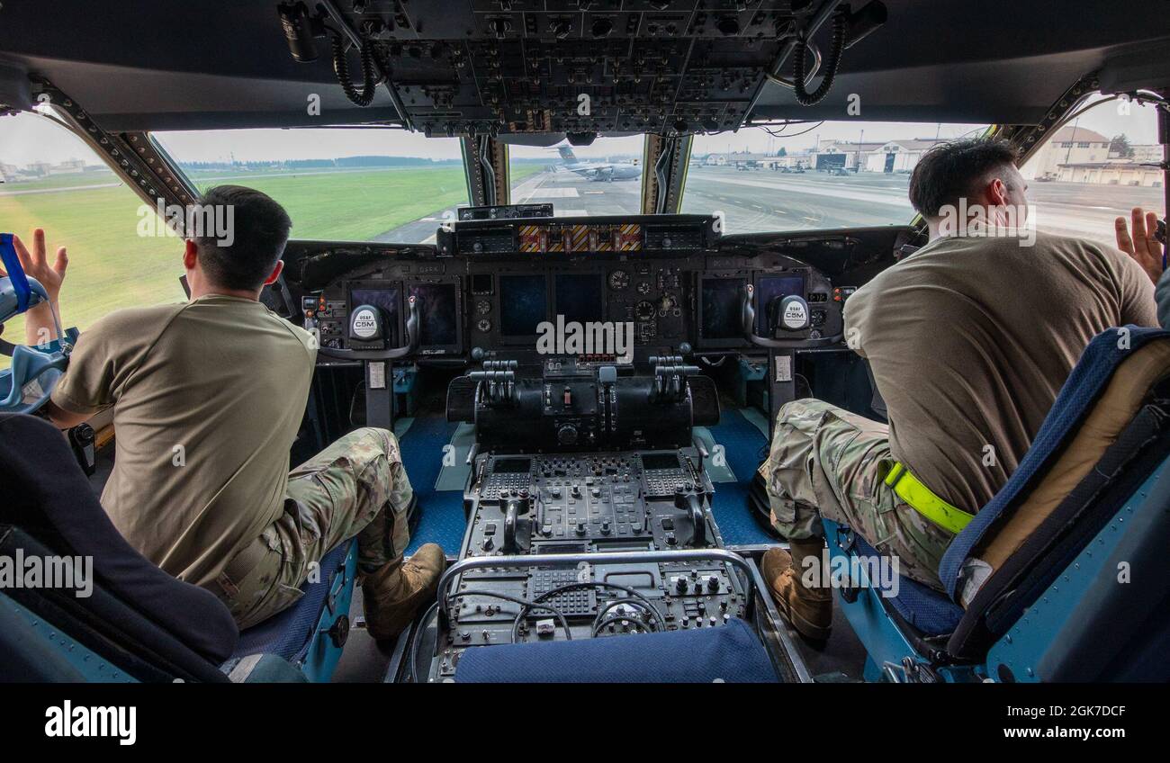 Staff Sgt. Adrian Diaz Jr., right, 730th Air Mobility Squadron engine ...
