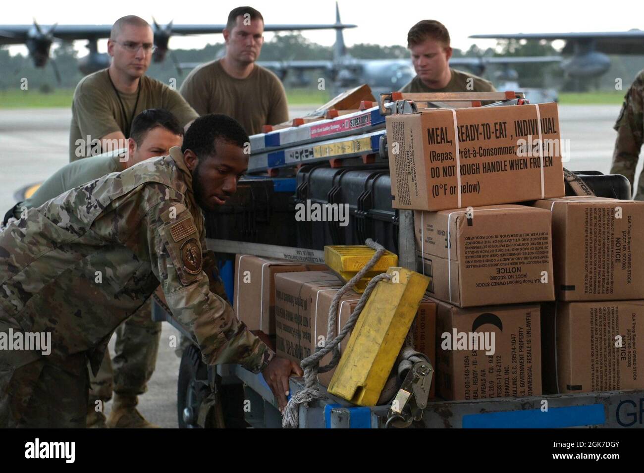 U.S. Air Force Airmen assigned to the 71st Rescue Squadron load an HC ...