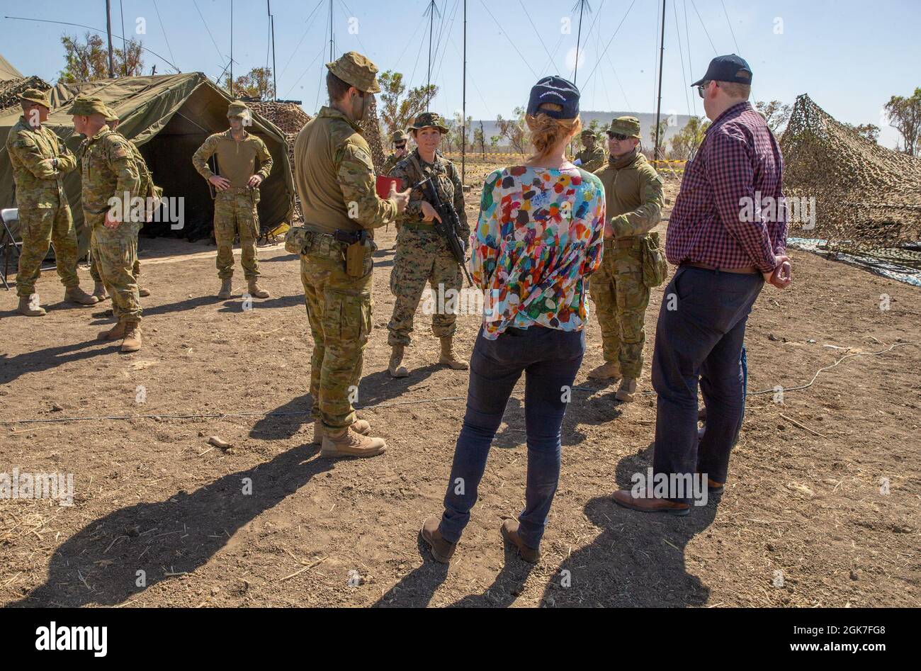 Australian Army Maj. Jake Penley, brigade major of 1 Brigade, mid-left ...