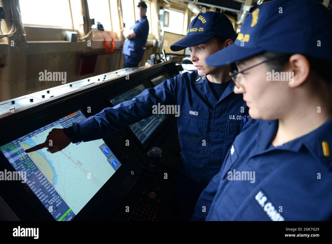 Ens. Valerie Hines and Ens. Emi Siler monitor the Coast Guard Cutter ...