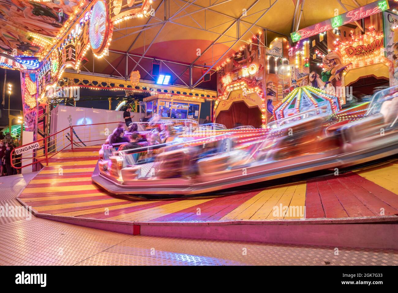 Selected focus and night scenery at illuminating amusement ride of ...