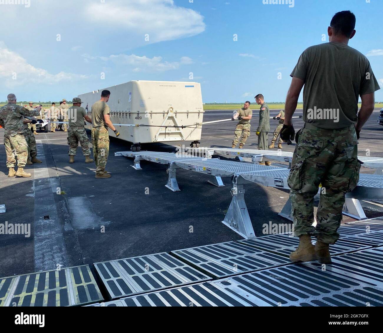 Members of the 147th Attack Wing prepare to load a MQ-9 Reaper on to a ...