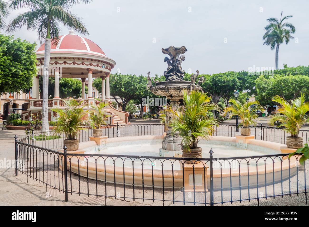 View of a fountain and a gazebo at Parque Central in Granada, Nicaragua ...