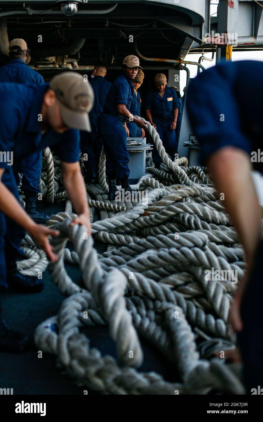 SAN DIEGO (Aug. 26, 2021) Sailors handle line on the fantail aboard the ...