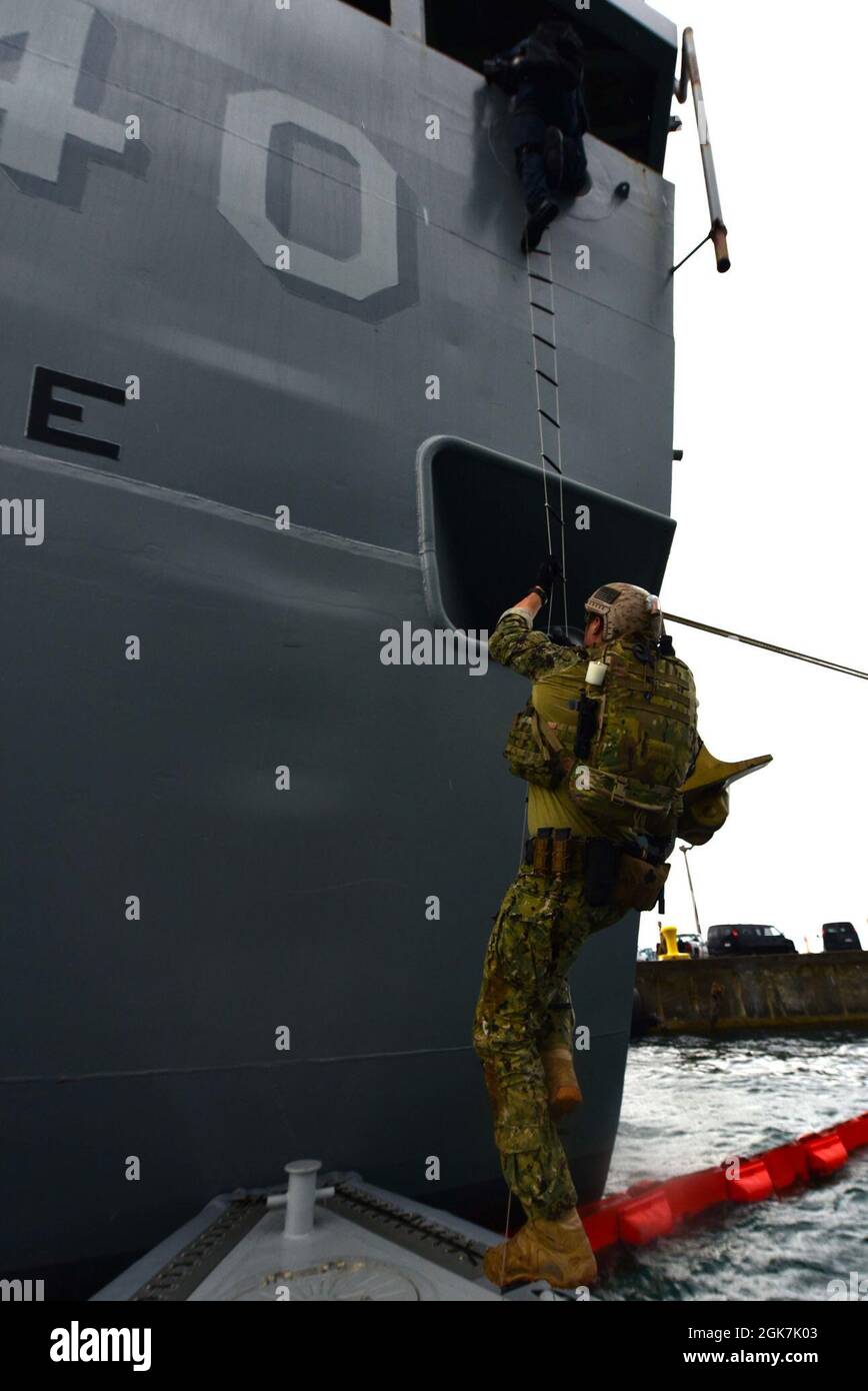 A U.S. Naval Special Warfare operator follows a Japan Maritime Self ...