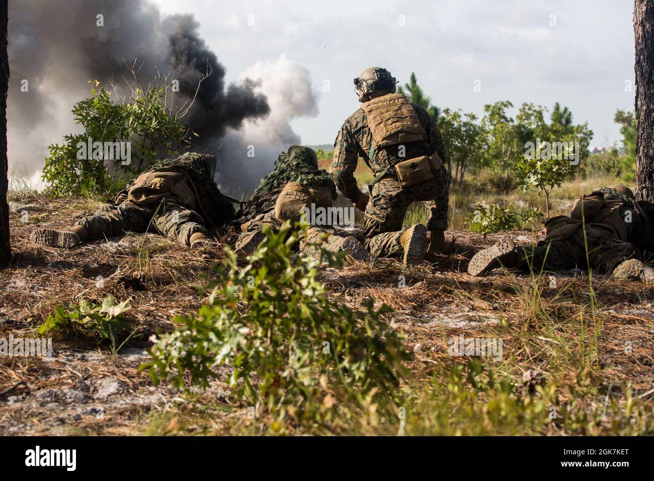U.S. Marines with Echo Company, School of Infantry East, engage their ...
