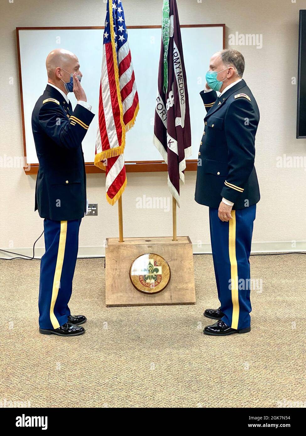 Lt. Col. Brian Adams (left) administers the oath of commissioned ...
