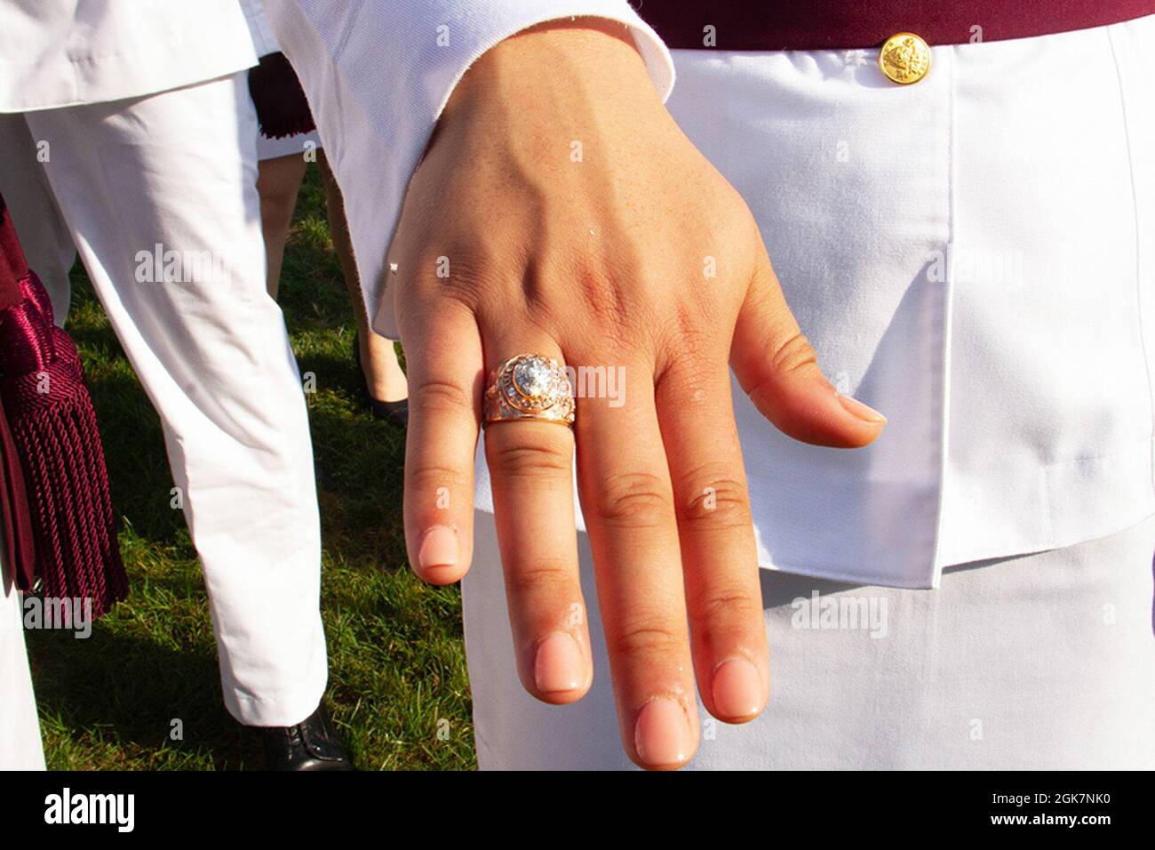 A Class of 2022 cadet shows off her class ring after the Ring Weekend ...