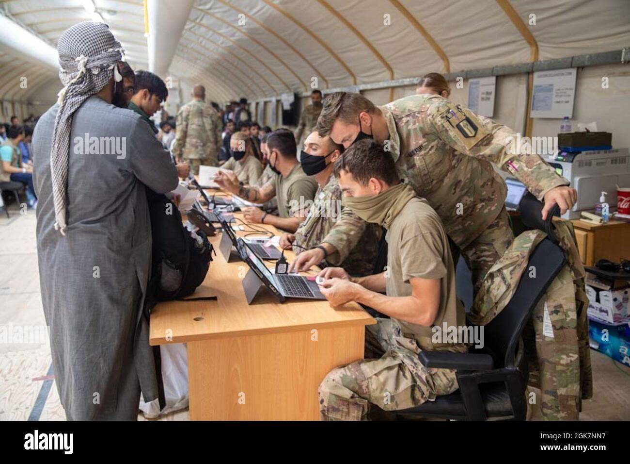 U.S. Army Central Soldiers welcome and assist Afghan evacuees as they arrive and process through ...