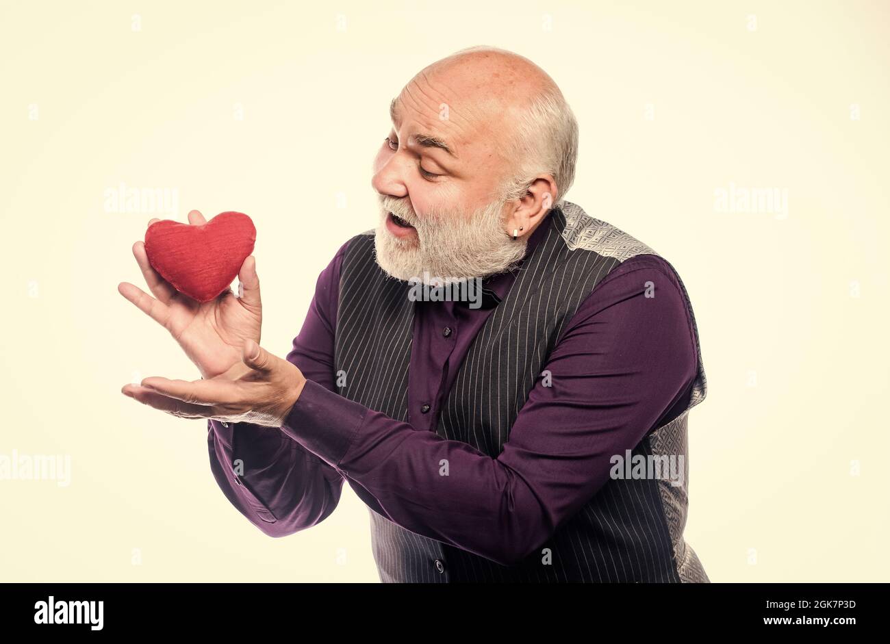 Health care. Senior bald head bearded man hold red heart. Preventing ...