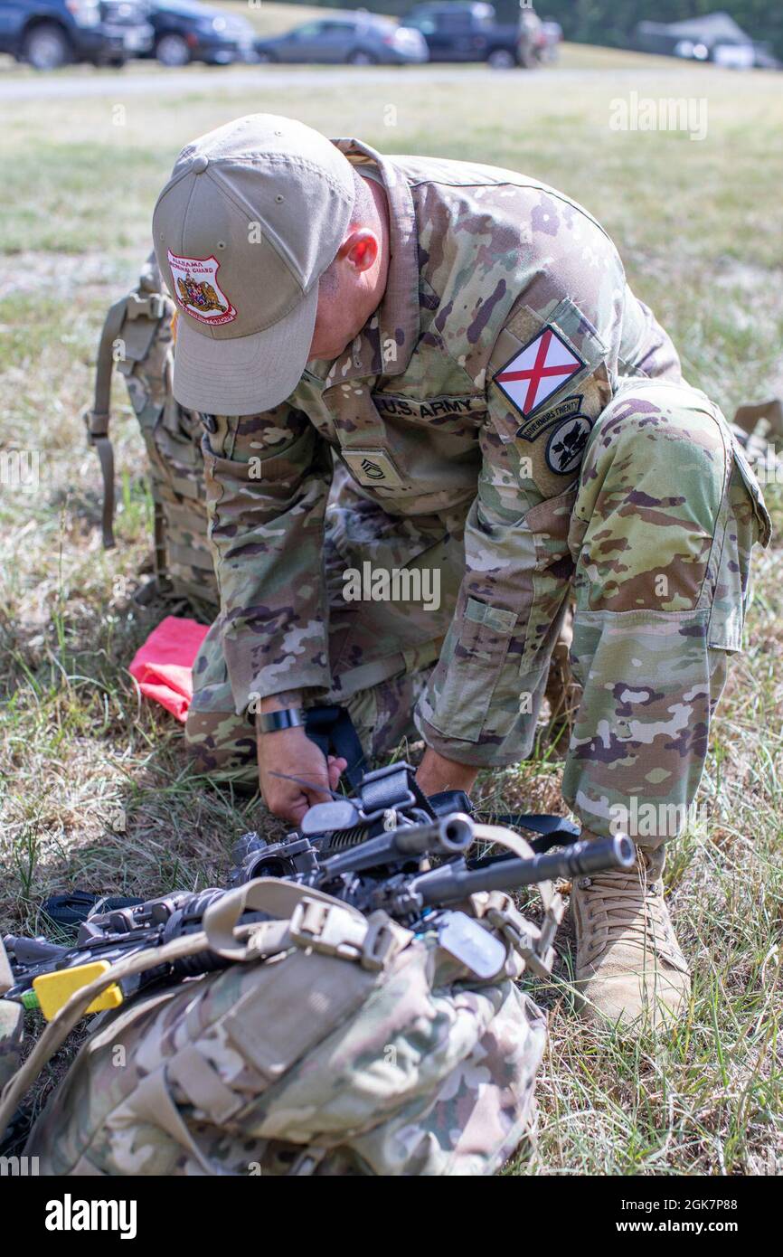 Sgt. First Class Aaron Ford, Alabama National Guard, slings his weapon ...