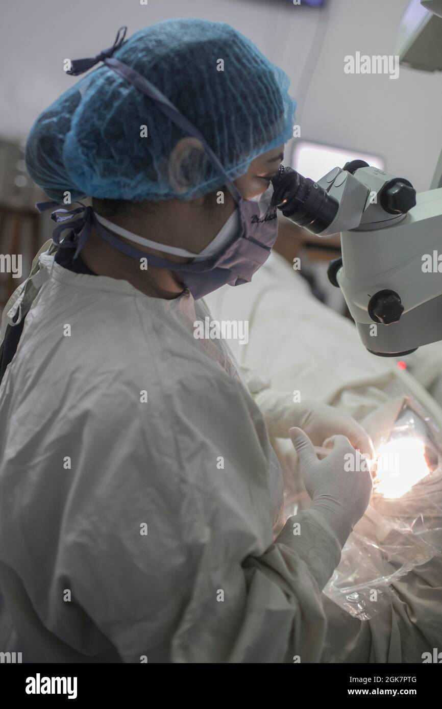Dr. Mahziba Rahman Chowdhury performs a surgical technique to remove a ...