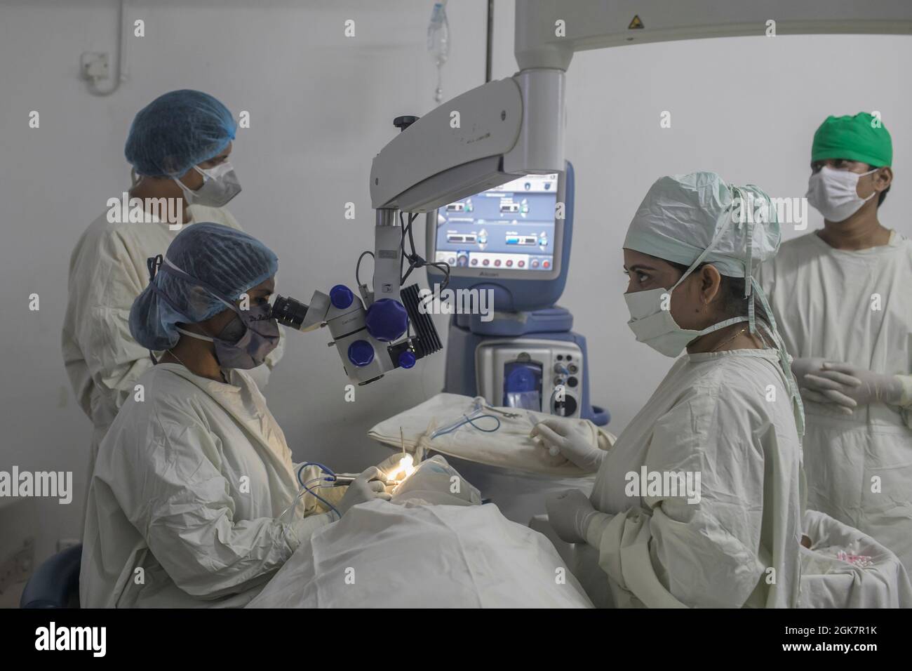 Dr. Rokhsanda Rehnuma performs a surgical technique to remove a ...