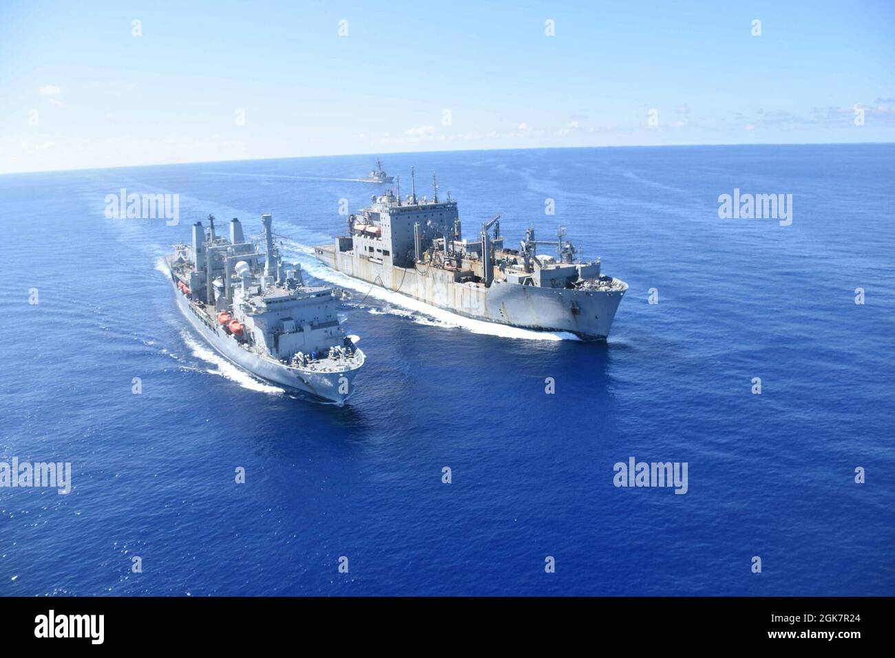 EAST CHINA SEA -- USNS Alan Shepard (T-AKE 3), left, conducts an ...