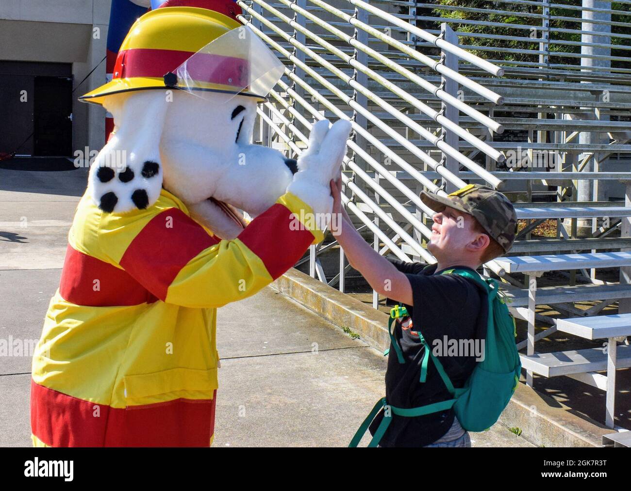 Ian Bolton, 5, gives Sparky the Fire Dog a high five during the ...