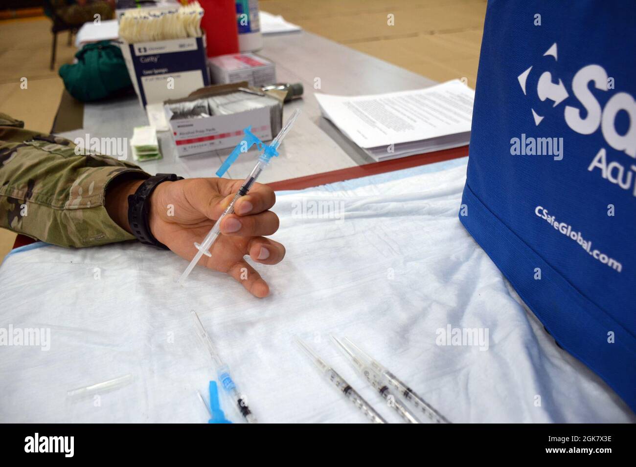Medical personnel prepares vaccinations for Operation Danger Prevention ...