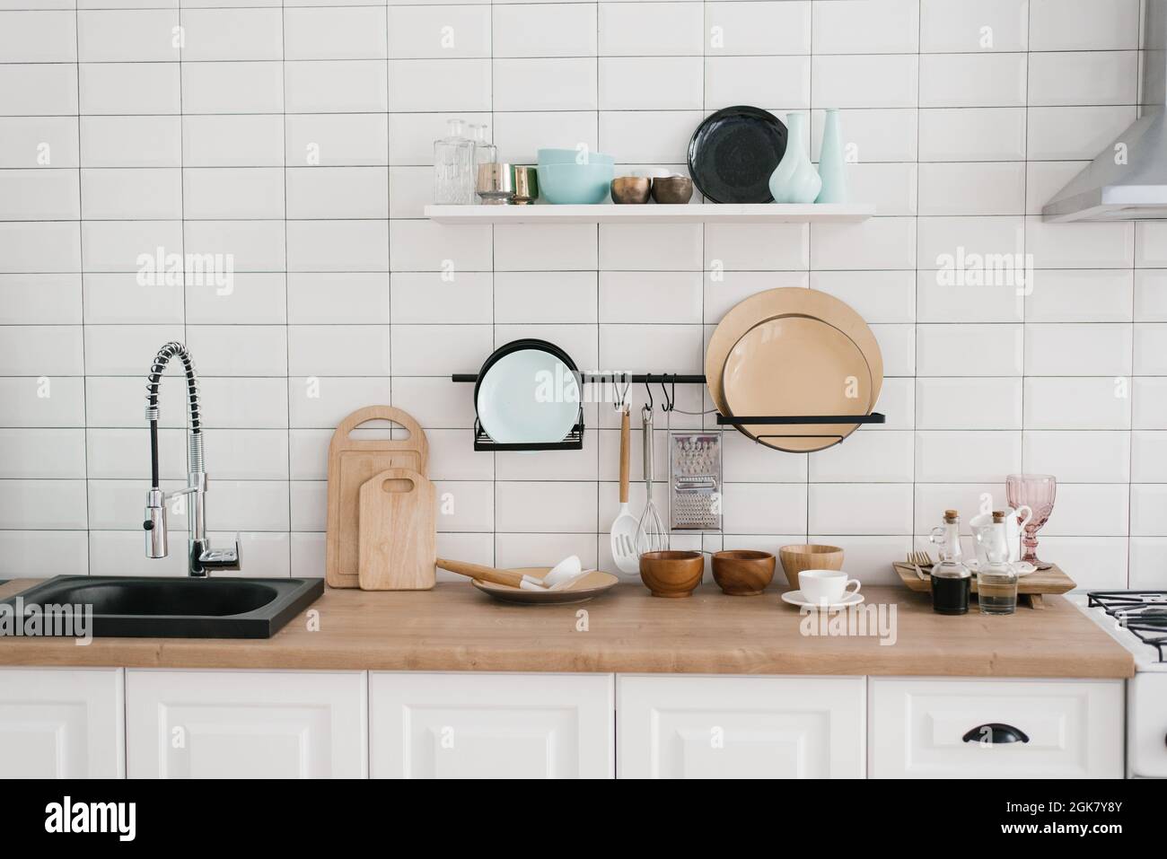 Kitchen utensils and utensils in the bright white wooden kitchen Stock ...