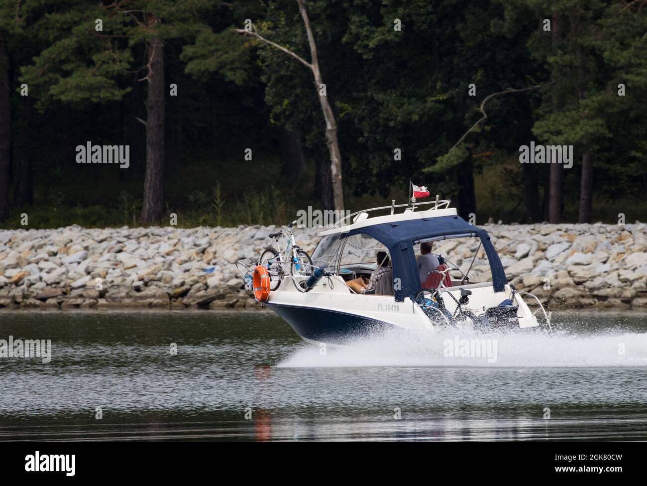 Scenic view of people driving a speedboat in the water Stock Photo - Alamy