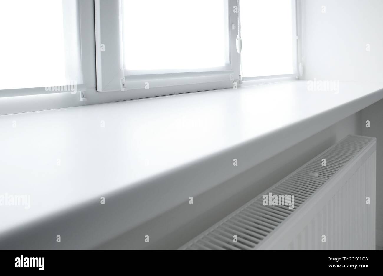 Modern white plastic window sill Stock Photo - Alamy