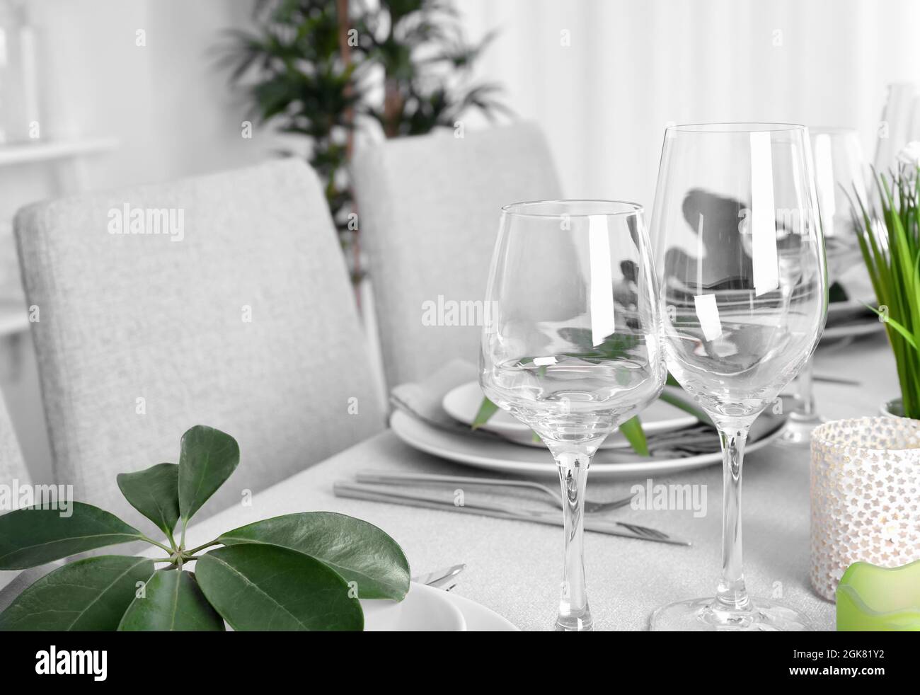Beautiful table setting with green tropical leaves Stock Photo - Alamy