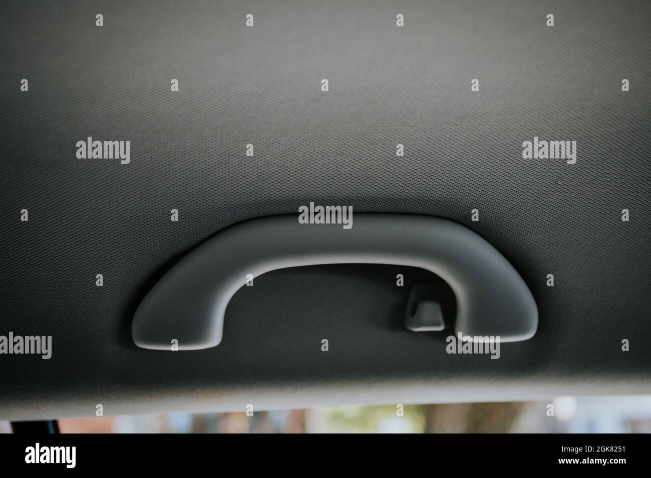 Closeup of the gray plastic handle on the car's ceiling Stock Photo - Alamy