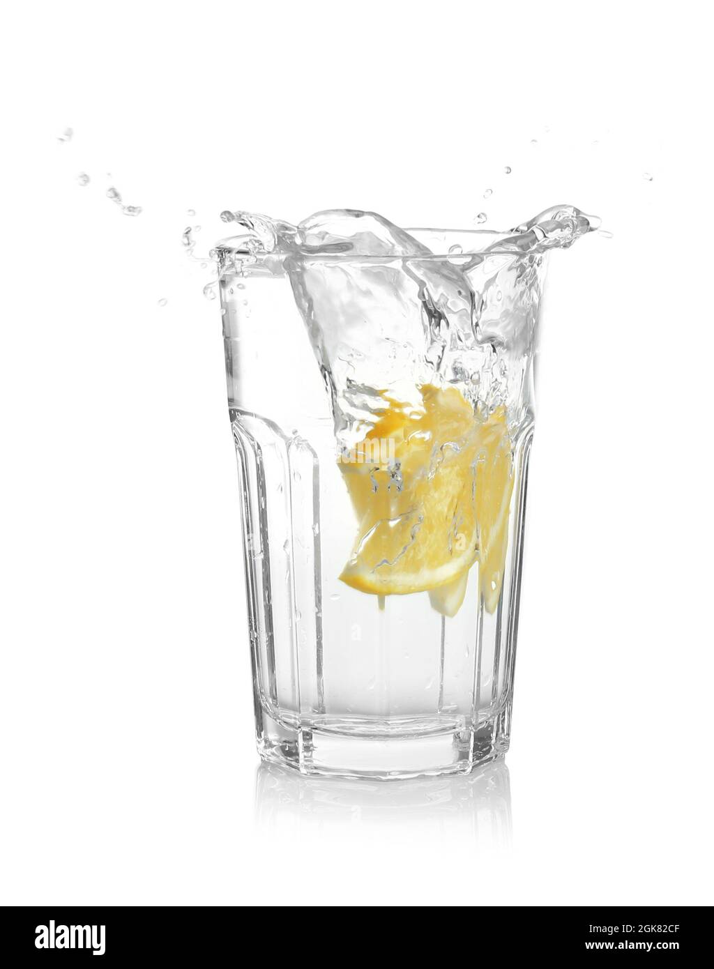 Glass of lemonade with splashing water on white background Stock Photo ...