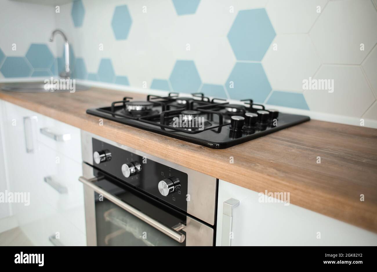 Interior of light modern kitchen with stove Stock Photo - Alamy