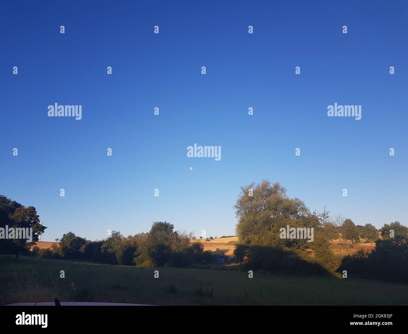 Sun rays falling on greenery-covered hills Stock Photo - Alamy