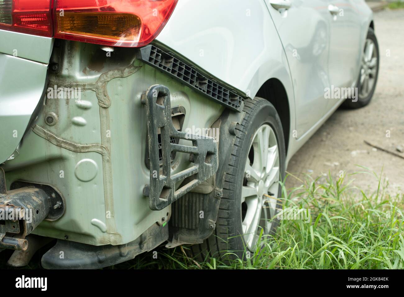 A wrecked car in the back. Damaged car. A broken piece of transport ...