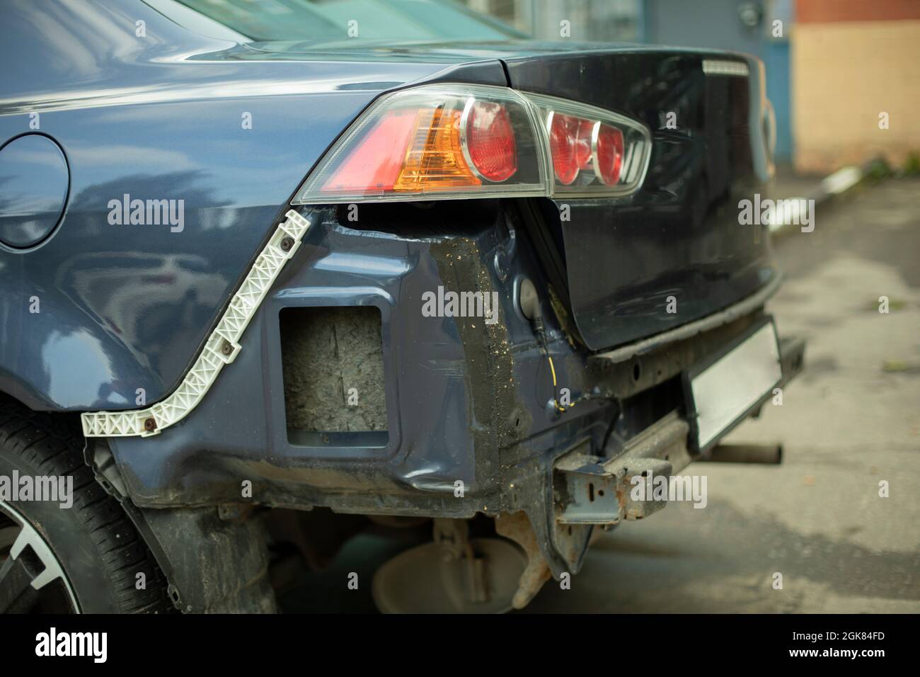 A car without a bumper. Damaged part of the transport. Car after the ...