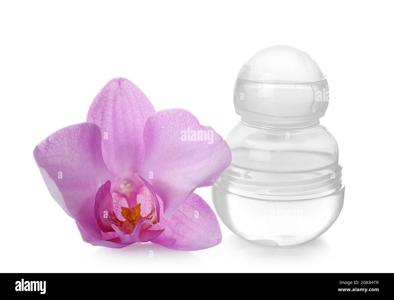Female deodorant and orchid flower on white background Stock Photo - Alamy