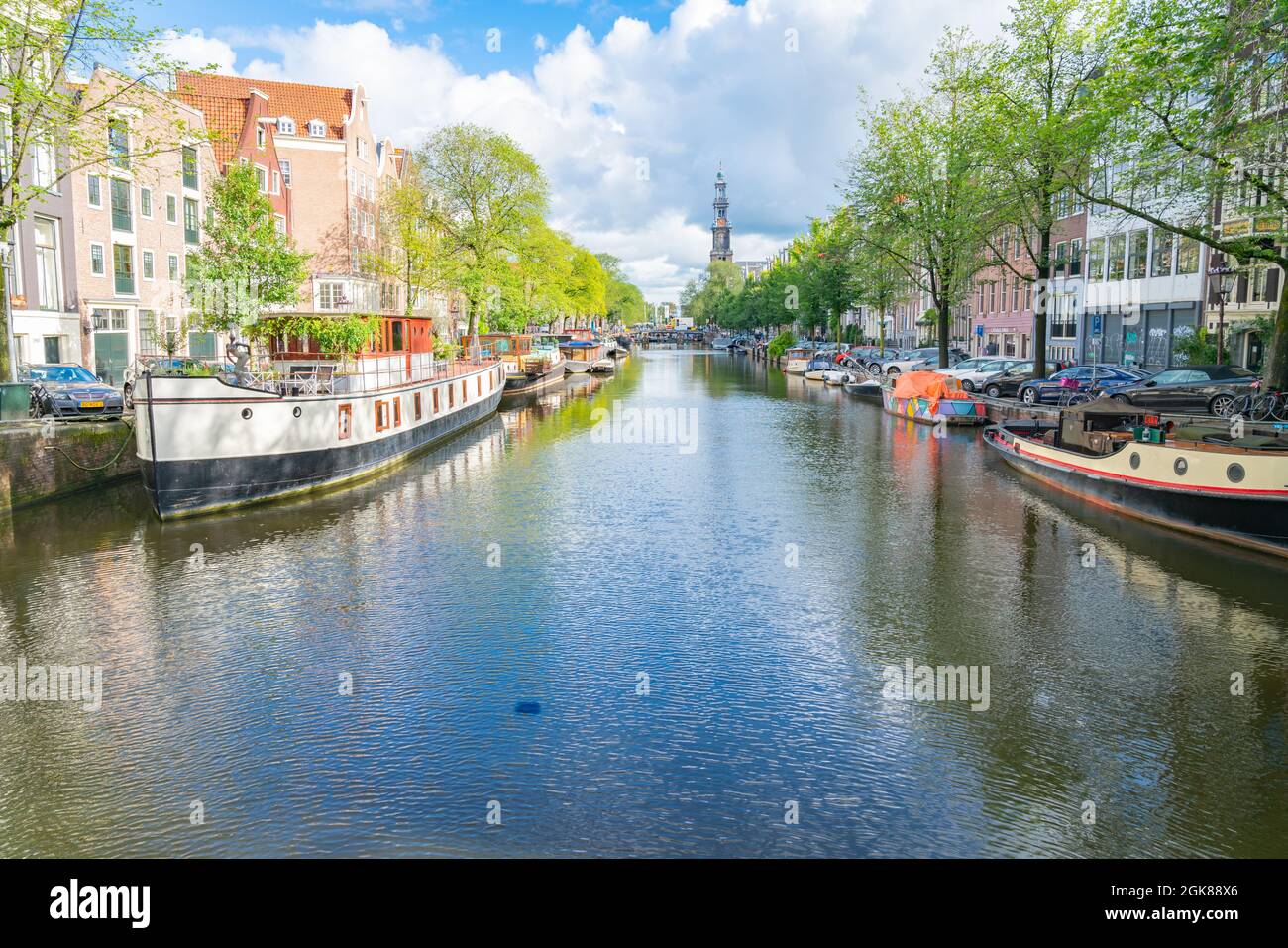 Amsterdam canal lined with traditional Dutch architecture of canal ...