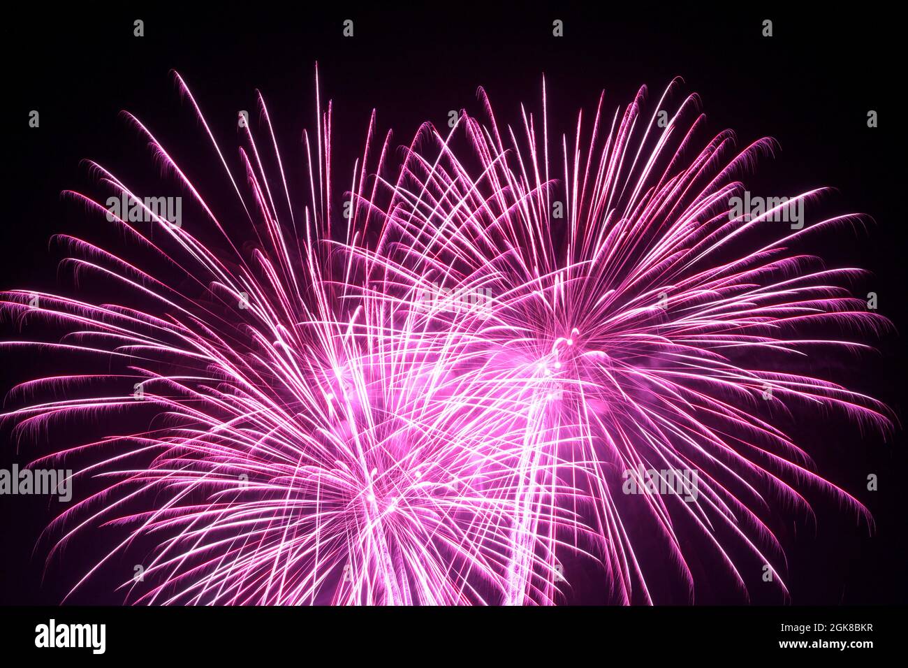 view on purple fireworks in night sky Stock Photo - Alamy