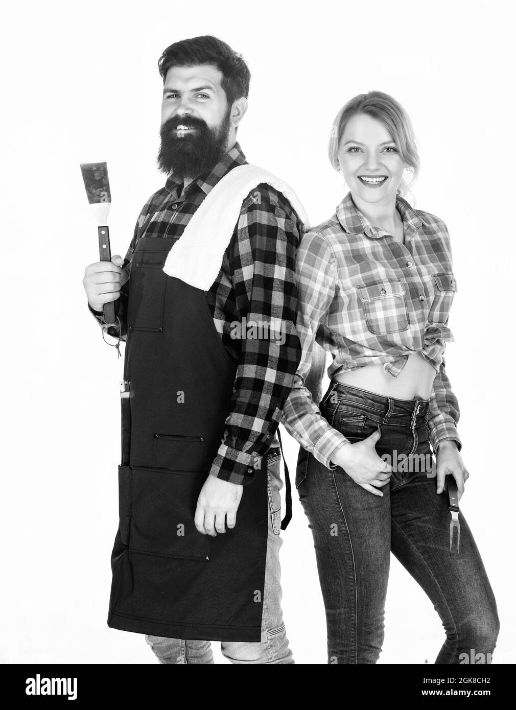 Family getting ready for barbecue. Bearded hipster and girl hold ...