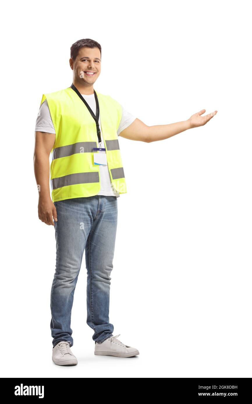 Young man in a safety vest showing with hand isolated on white ...