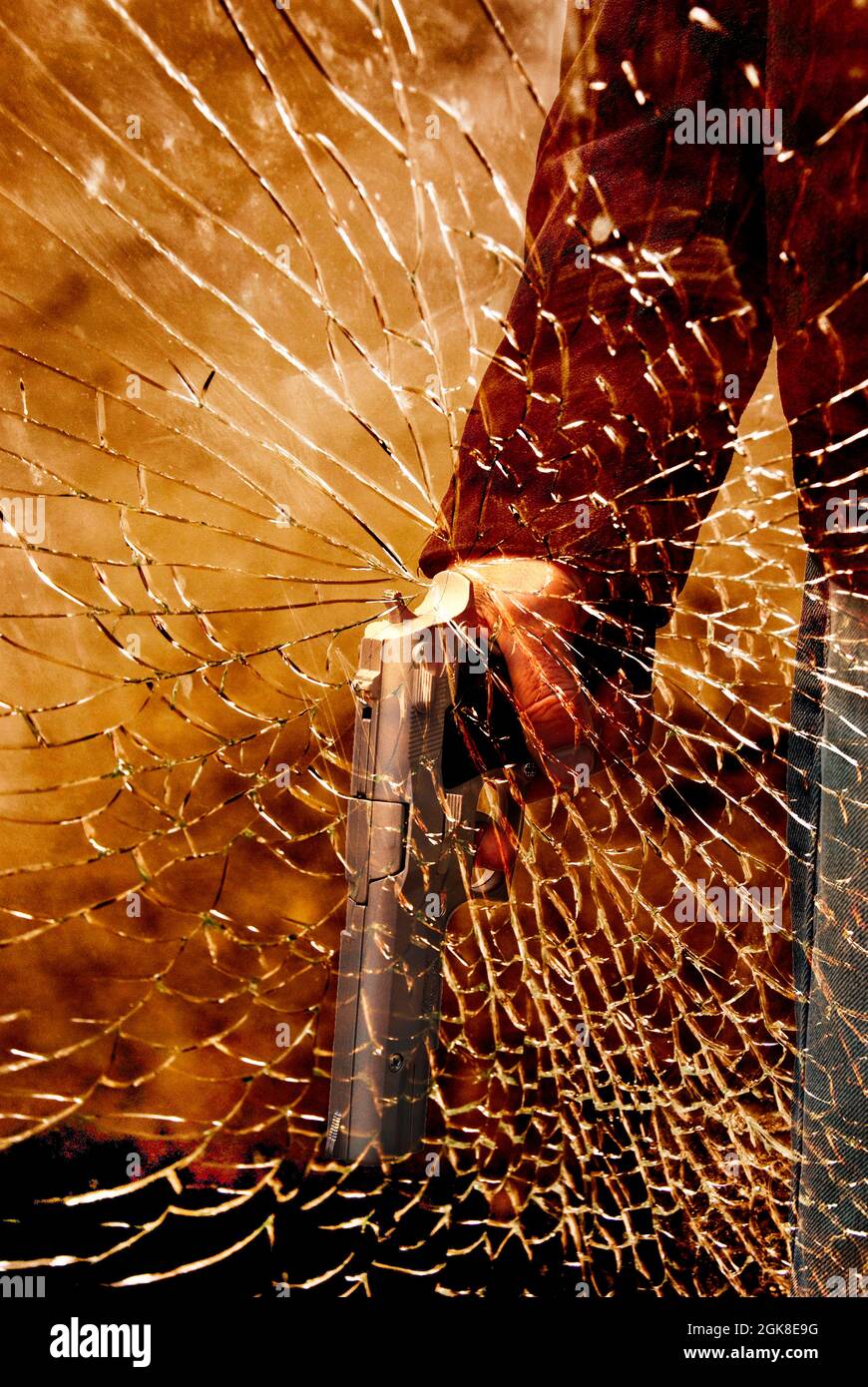 man with gun behind a broken glass Stock Photo - Alamy