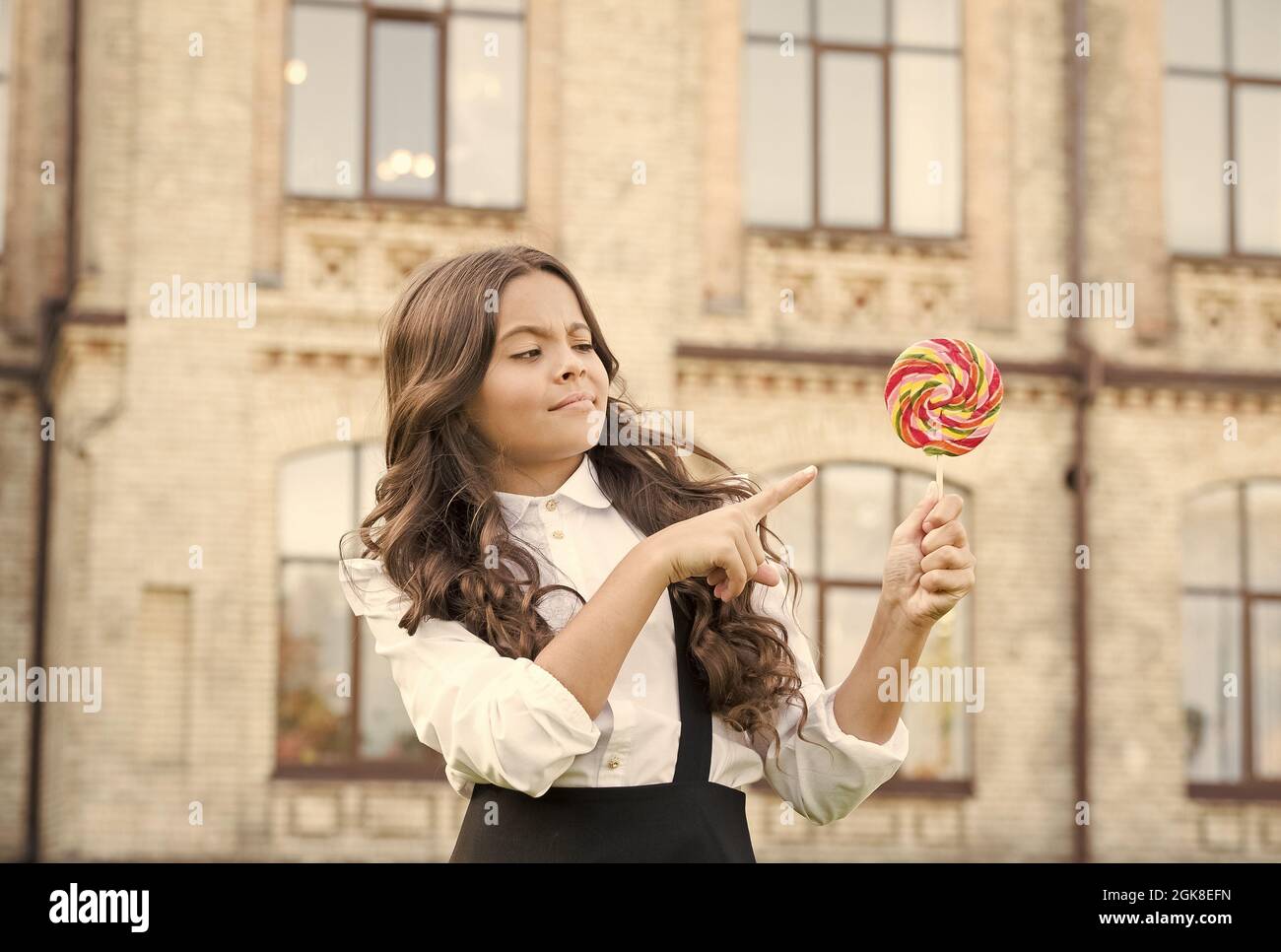 Sugar diet. Sweet joy. Happy kid with sweet candy. Happy childhood. Kid ...