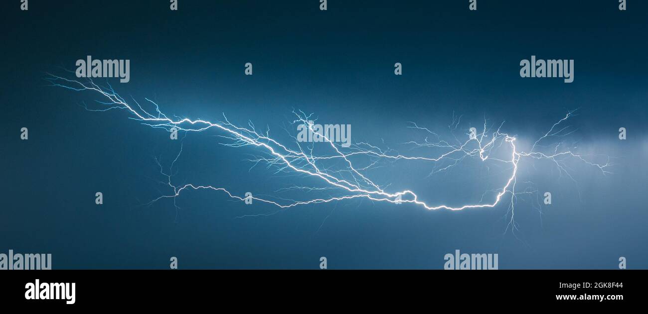 Forked lightning bolt high up in the sky, also known as an anvil ...