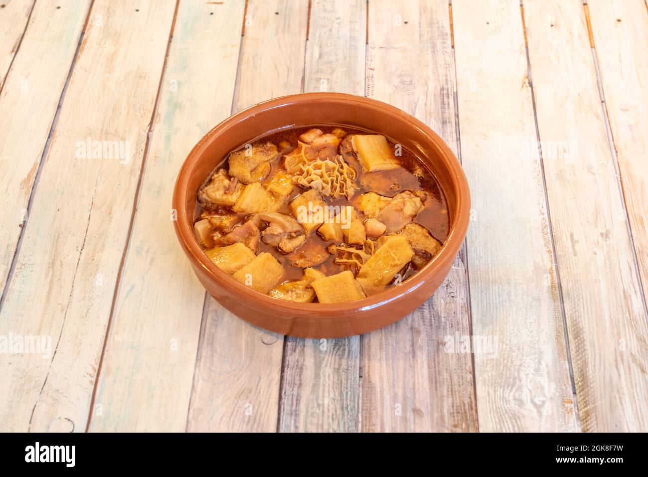 Traditional clay dish with a recipe for Madrid tripe with chorizo and ...