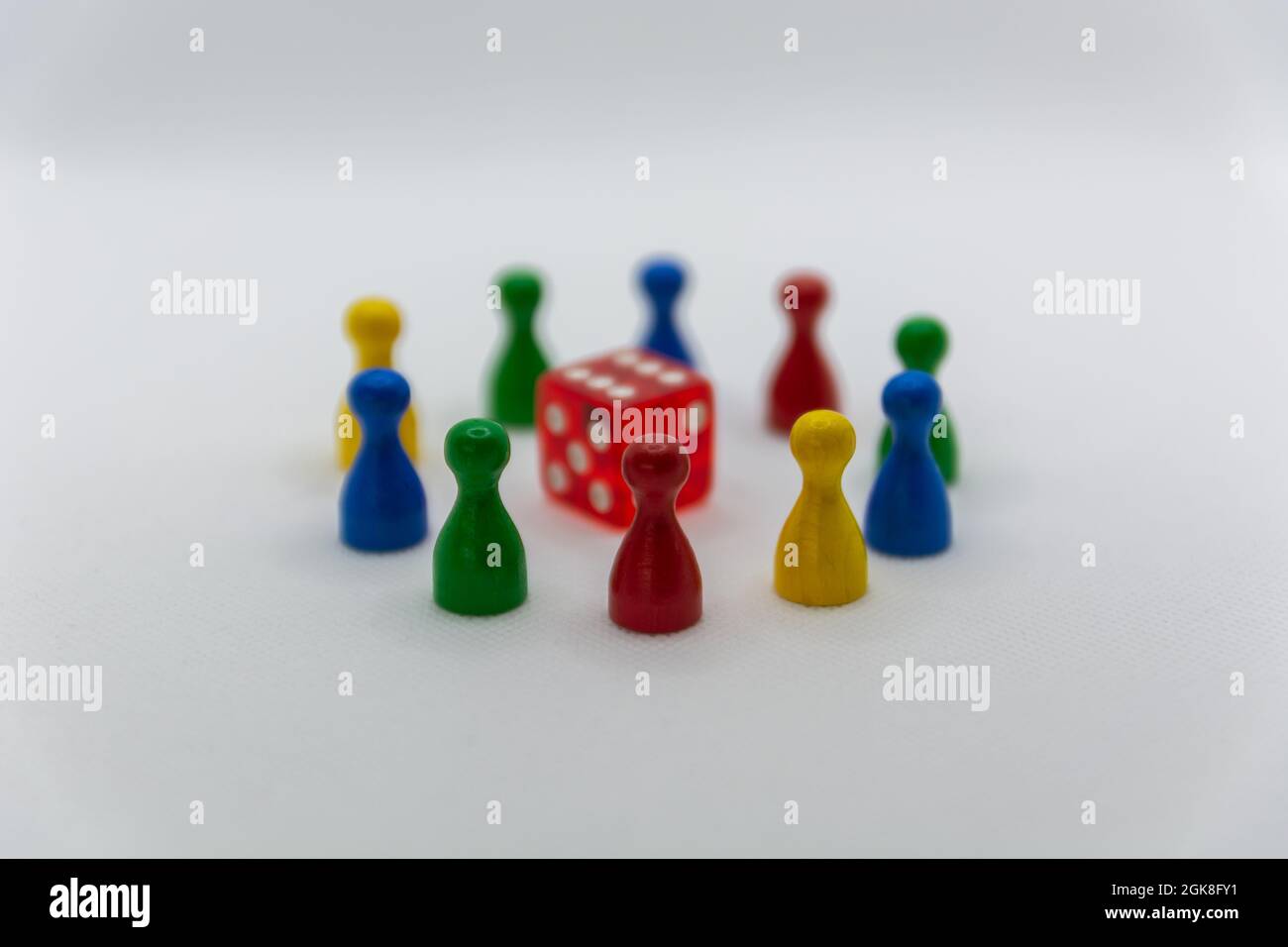 Different colours and shapes of pawn pieces and dices from board games ...