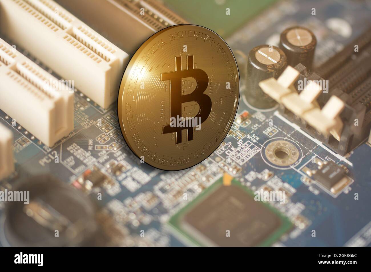 Bitcoin gold coin against computer motherboard background. Extraction ...