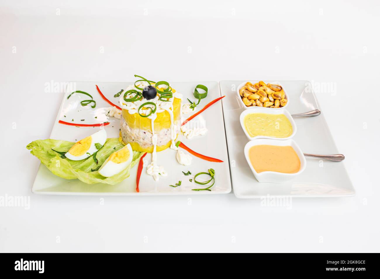 image of a portion of Peruvian causa limeña garnished with mayonnaise ...