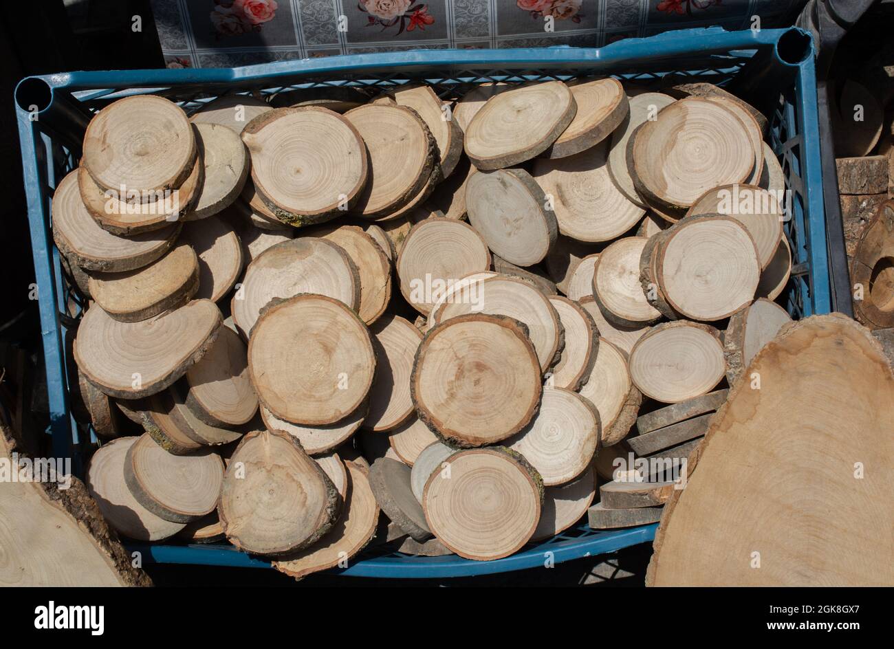 Top view of small tree stump circle pieces in the box under the sunligh ...