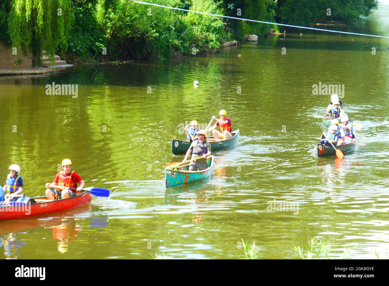 People on canoes in the Forest of Dean Gloucestershire UK river hot ...