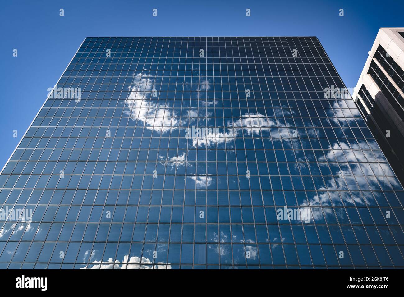 Mirror Facade of high-rise building, reflecting clouds Stock Photo - Alamy