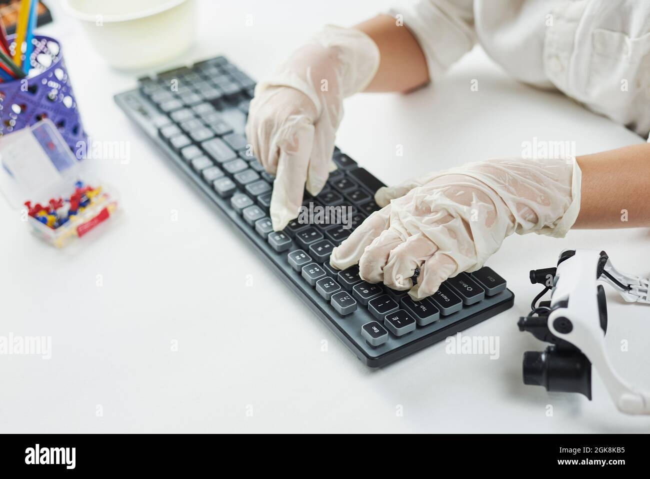Cropped shot of schoolboy hands typing on the computer keyboard Stock ...