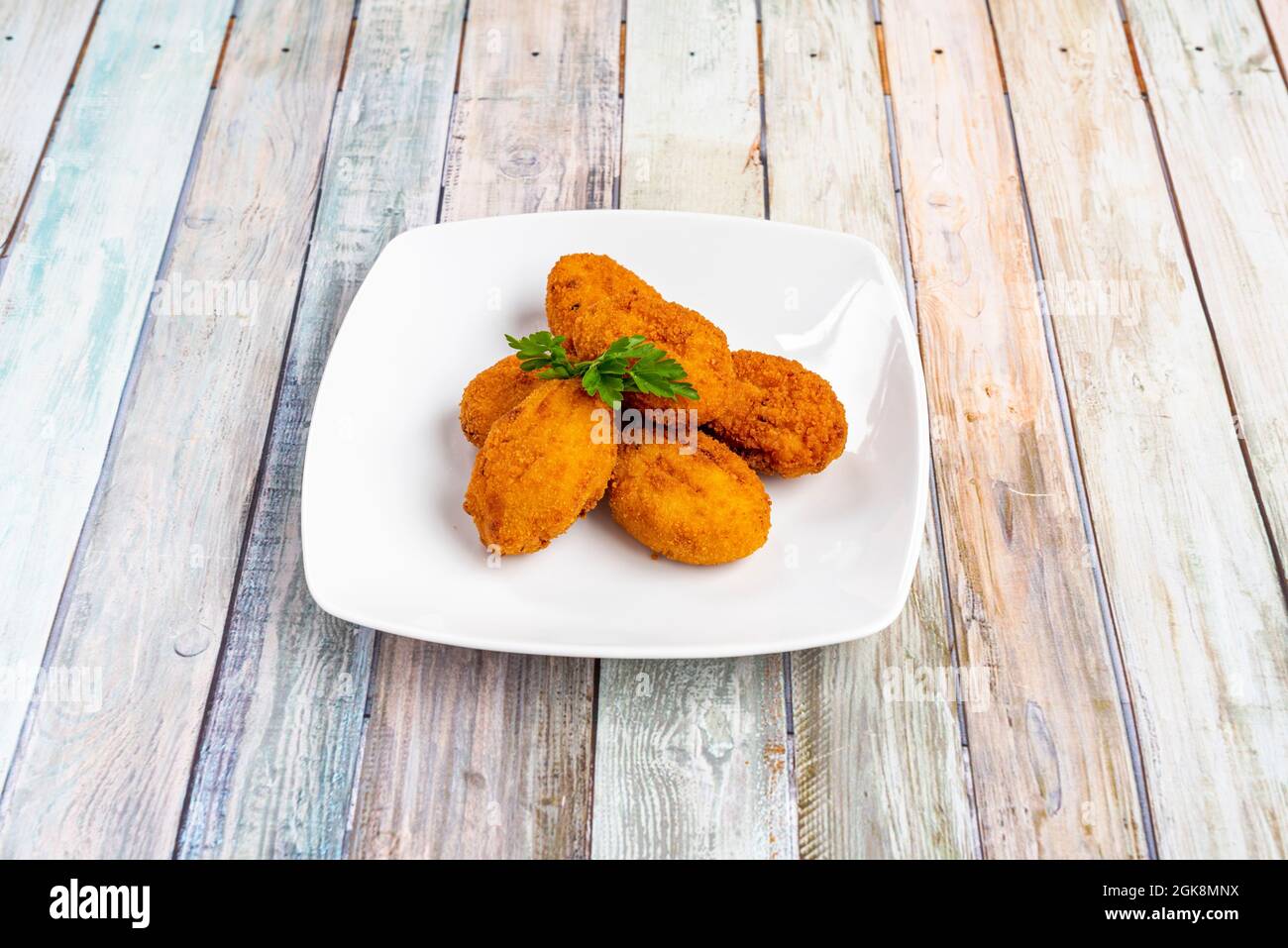 ration of croquettes breaded in bread stuffed with Iberian ham ready to ...