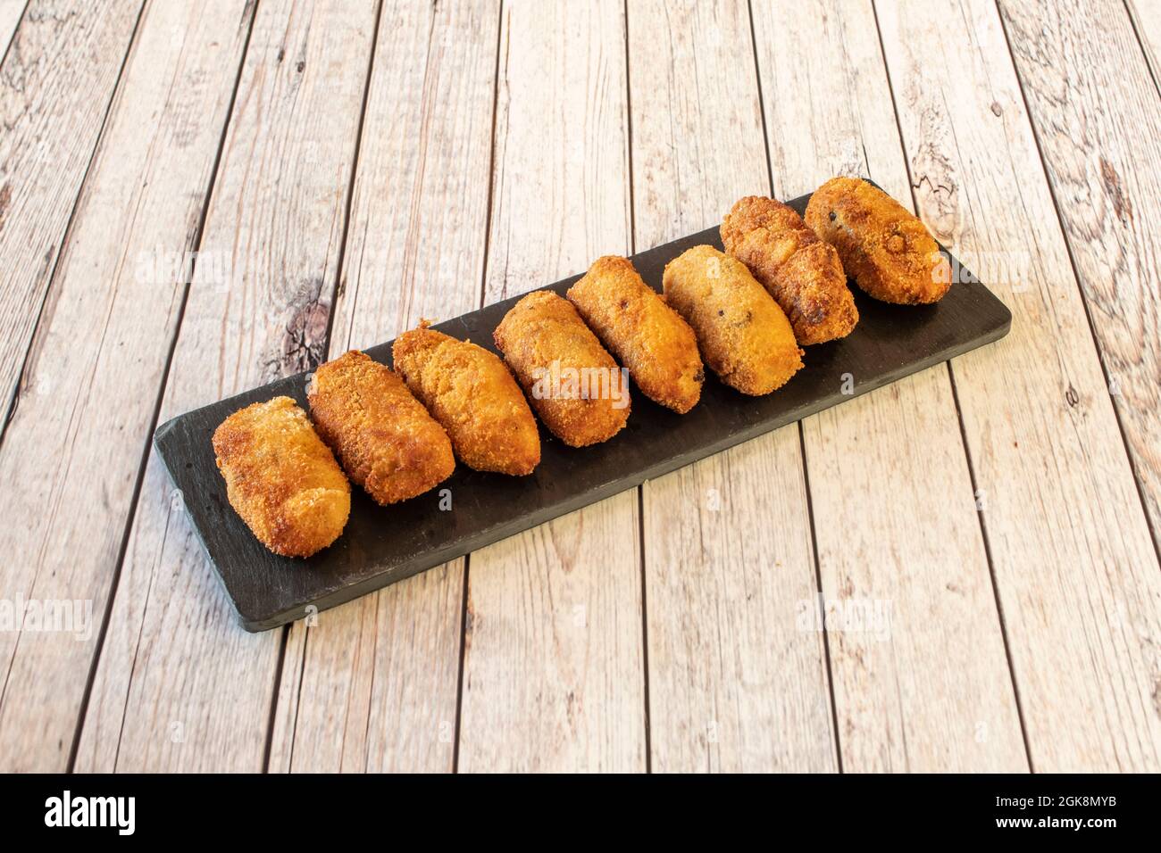 Group of homemade croquettes flavored with cod well fried and breaded ...