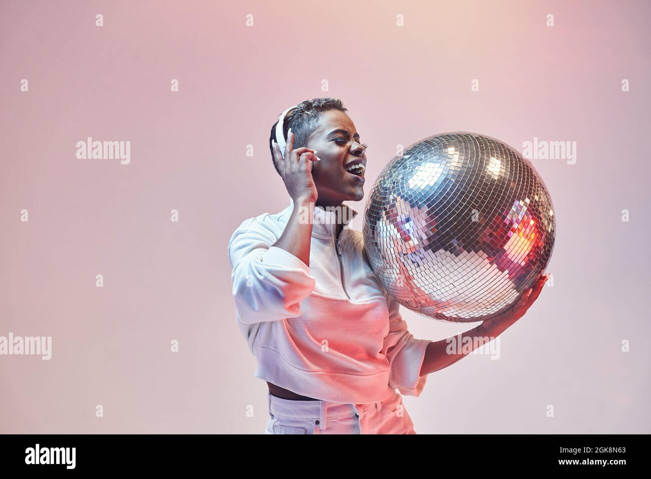 Cool ethnic cheerful Woman with short hair in wireless headset and ...