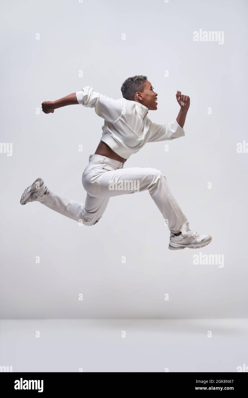 Full body young african woman jump hi-res stock photography and images ...
